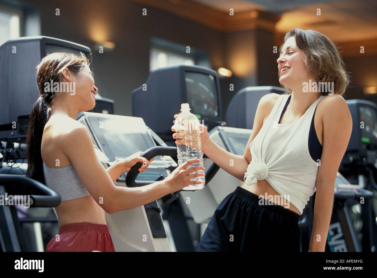Women friends take a break at the gym Stock Photo - Alamy