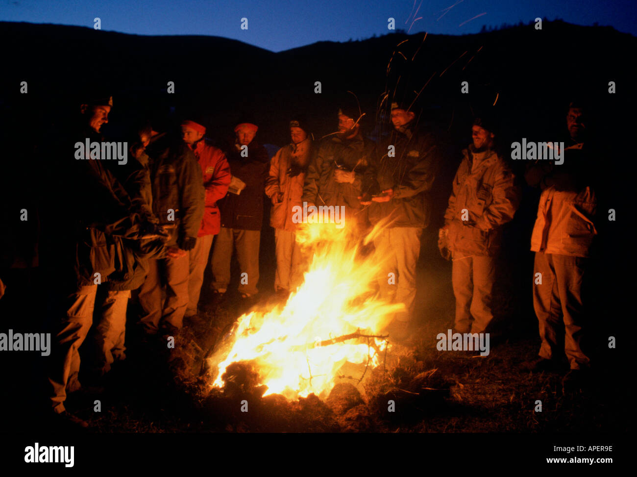 Campers enjoying an open fire, Mongolia Stock Photo - Alamy