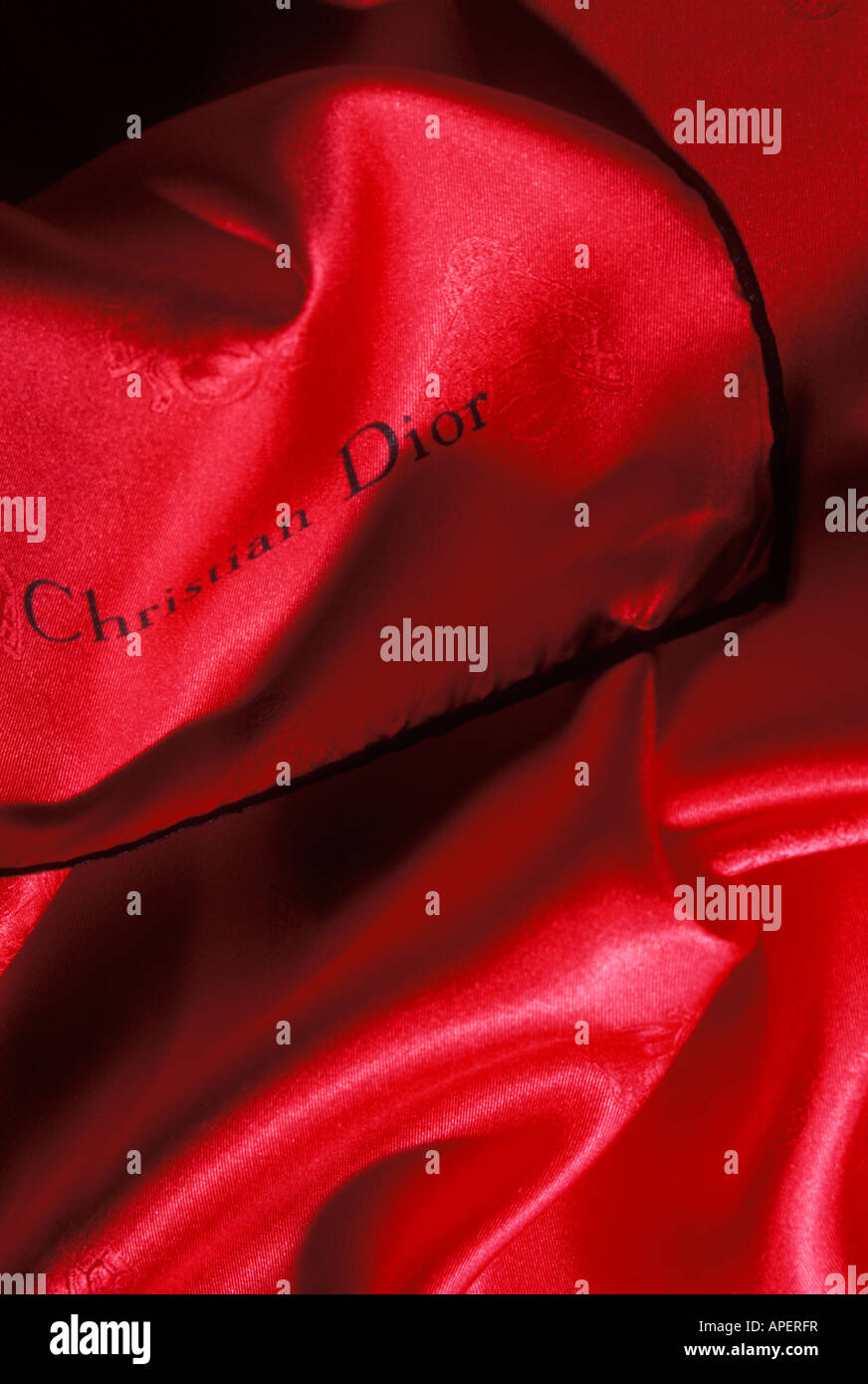 A close-up shot of a Christian Dior red silk scarf Stock Photo - Alamy