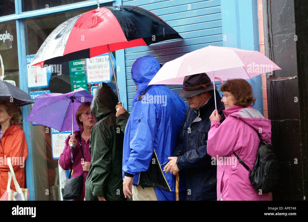 Shelter under umbrellas hi-res stock photography and images - Alamy