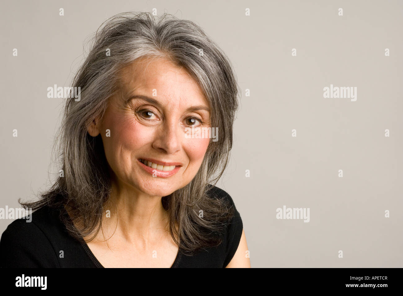 Studio shot of mature woman headshot Stock Photo - Alamy
