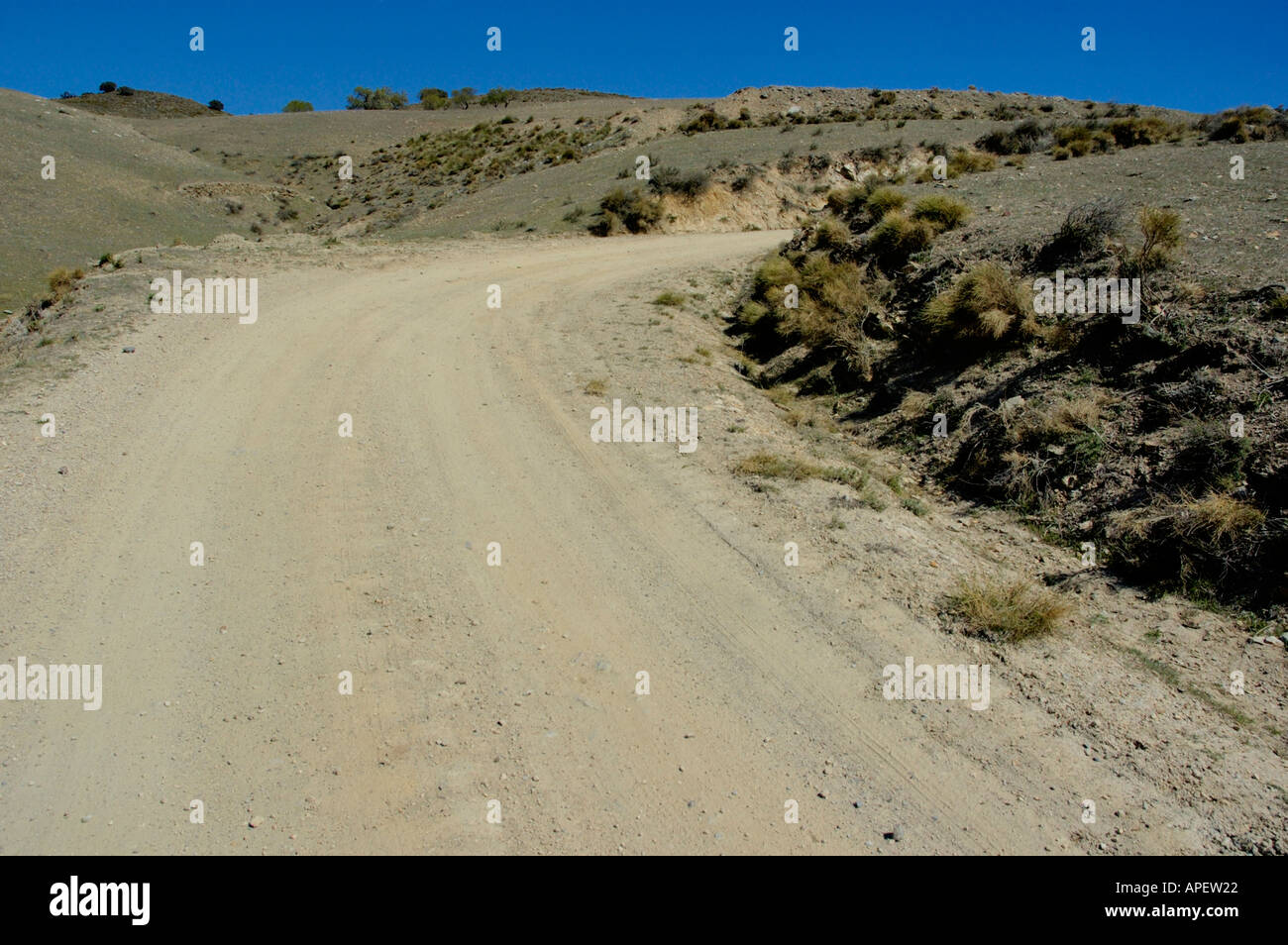 Spain andalusia a curved dirt road in the alpujarras mountains near ...