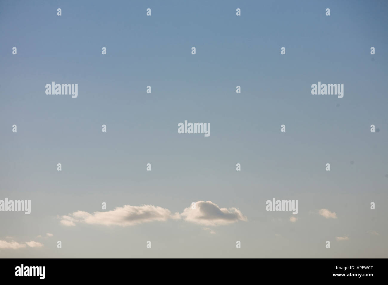 A clear sky with a few clouds on a summer day Stock Photo - Alamy
