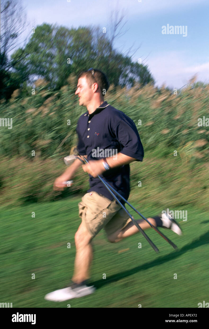 GOLFER RUNNING ACTION Stock Photo - Alamy