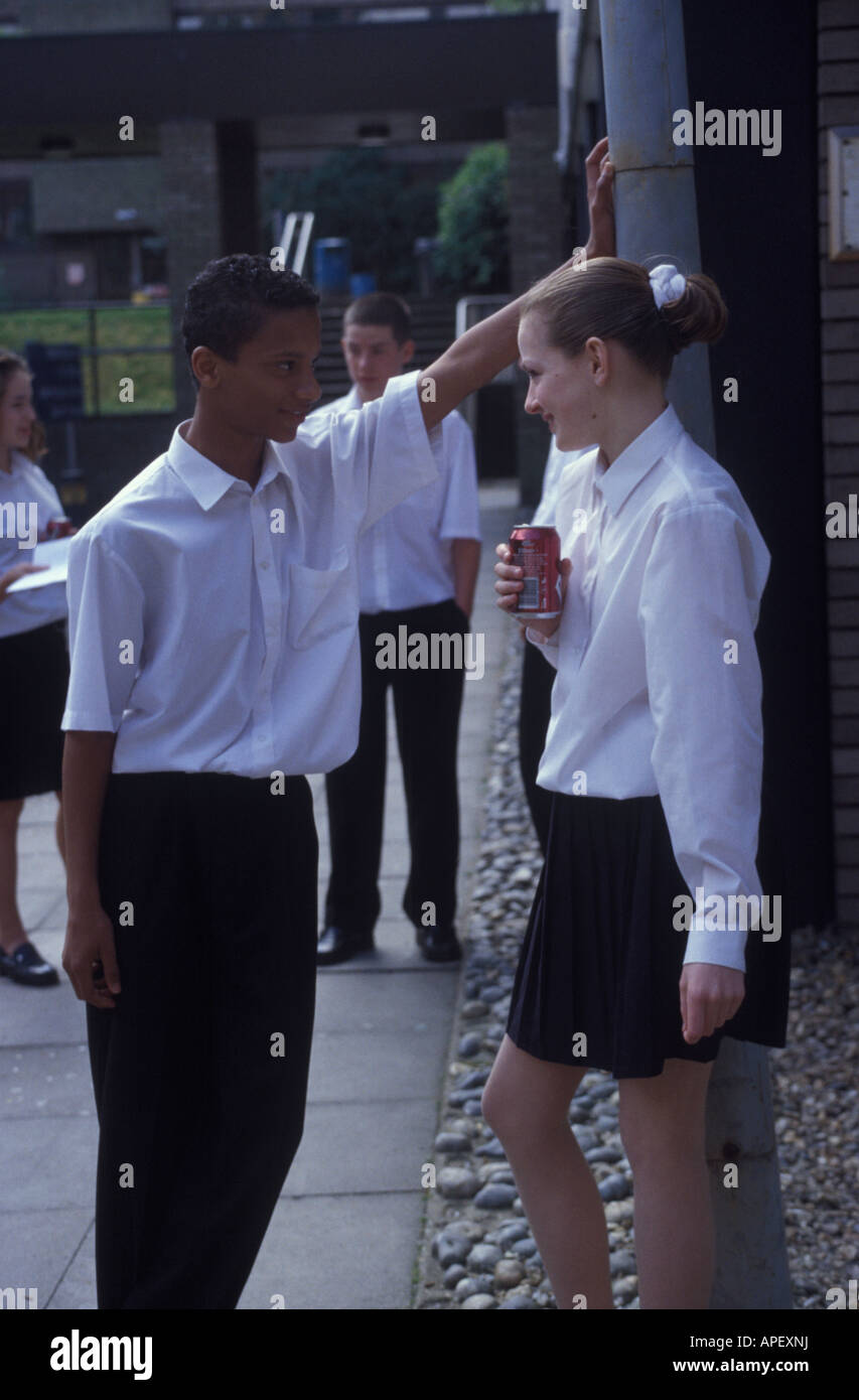 boy chatting up girl in school Stock Photo - Alamy