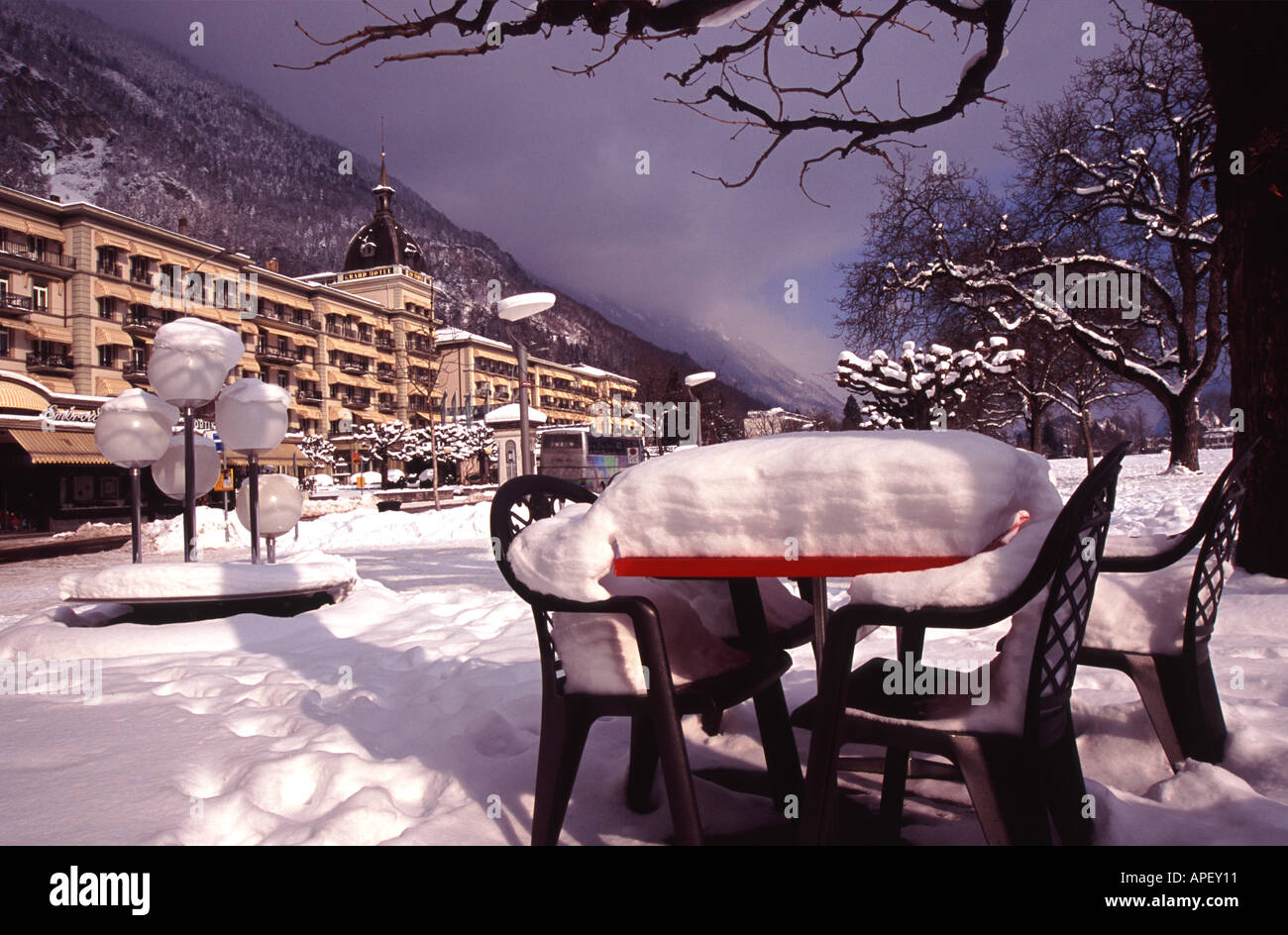 INTERLAKEN, SWITZERLAND. Winter snow in Hohe-Matte park, with the Grand ...