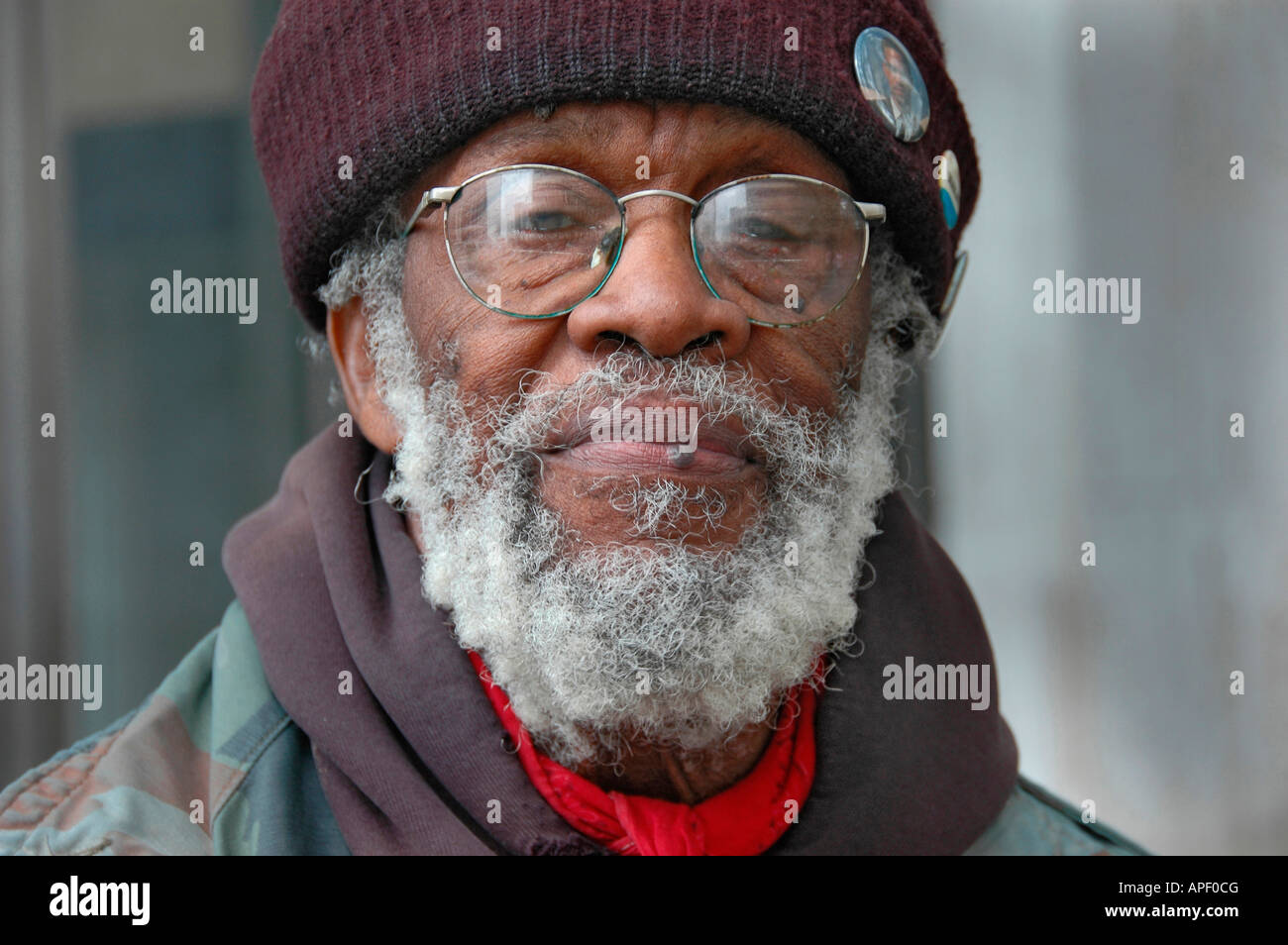 Senior Black man with health problems and missing teeth and glasses ...