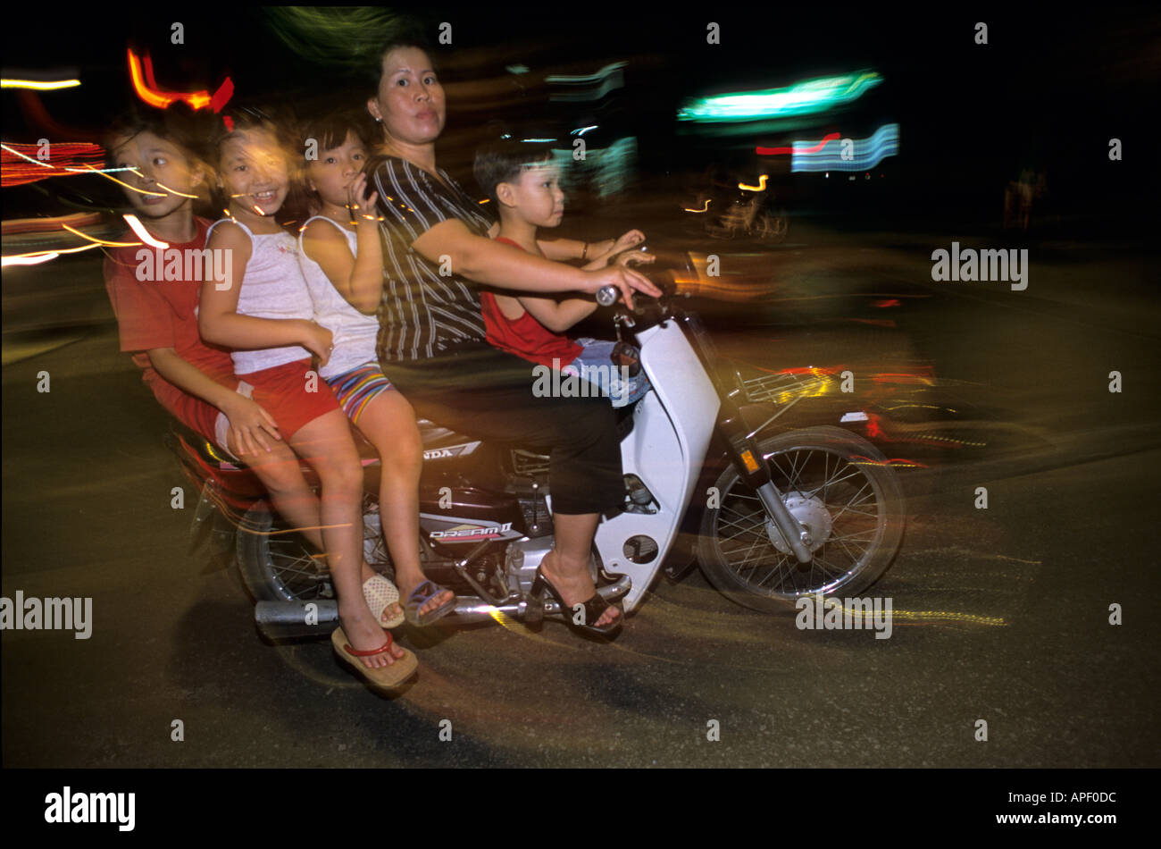 Family on motorcycle Hanoi Vietnam Stock Photo - Alamy