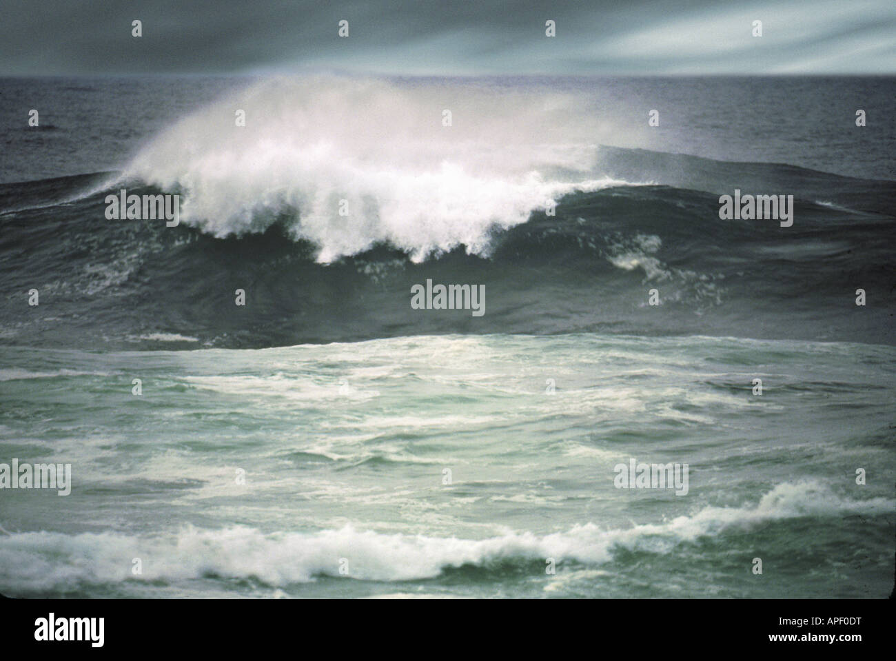 Large wave, gray water and foreboding stormy sky in background Stock ...