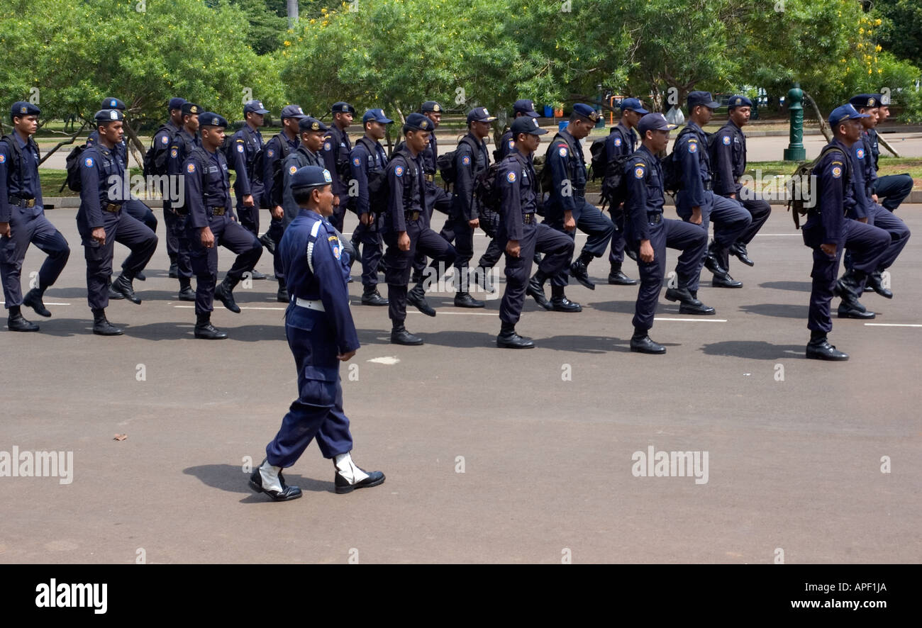 Indonesian police officers in central Jakarta practising marching and ...