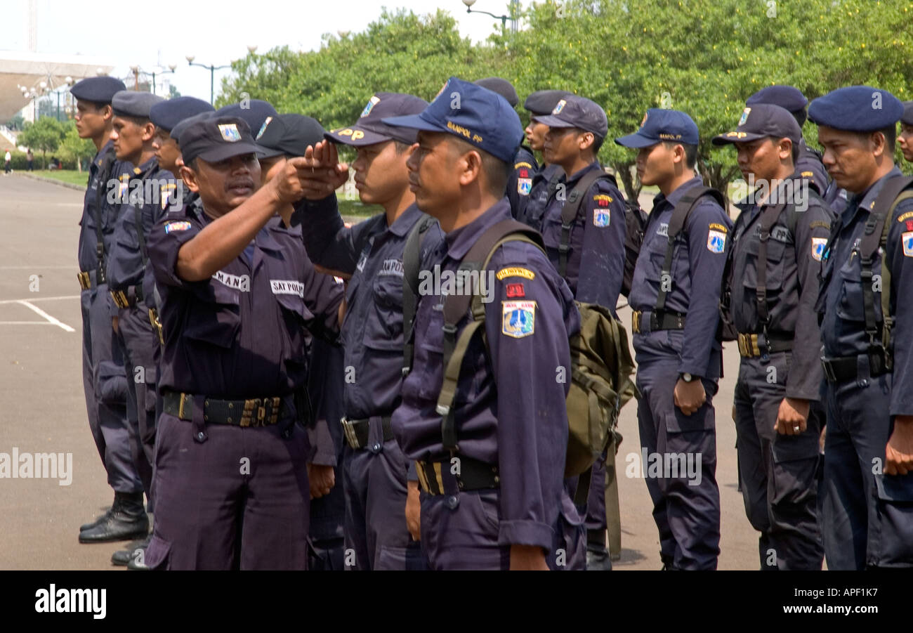 Indonesian police officers in central Jakarta practising marching and ...