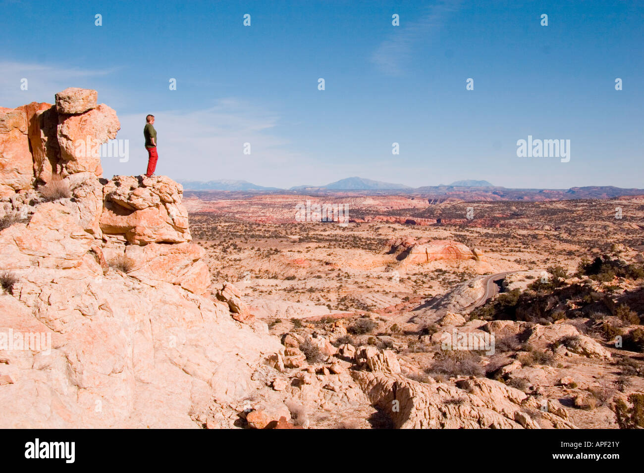 A woman looks out at the view of the geologic layers of rock Stock ...