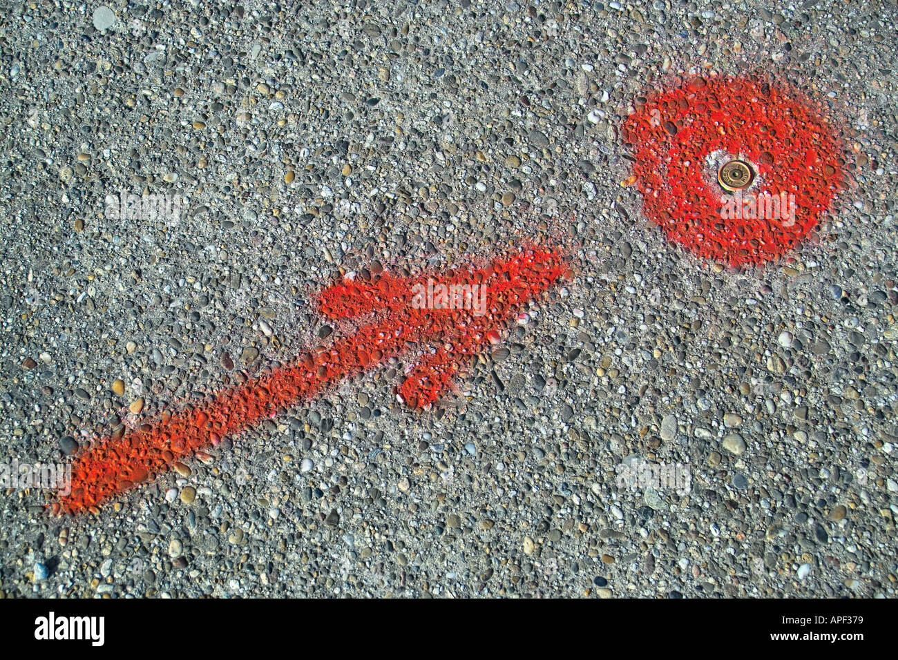 Red arrow on the road Stock Photo - Alamy