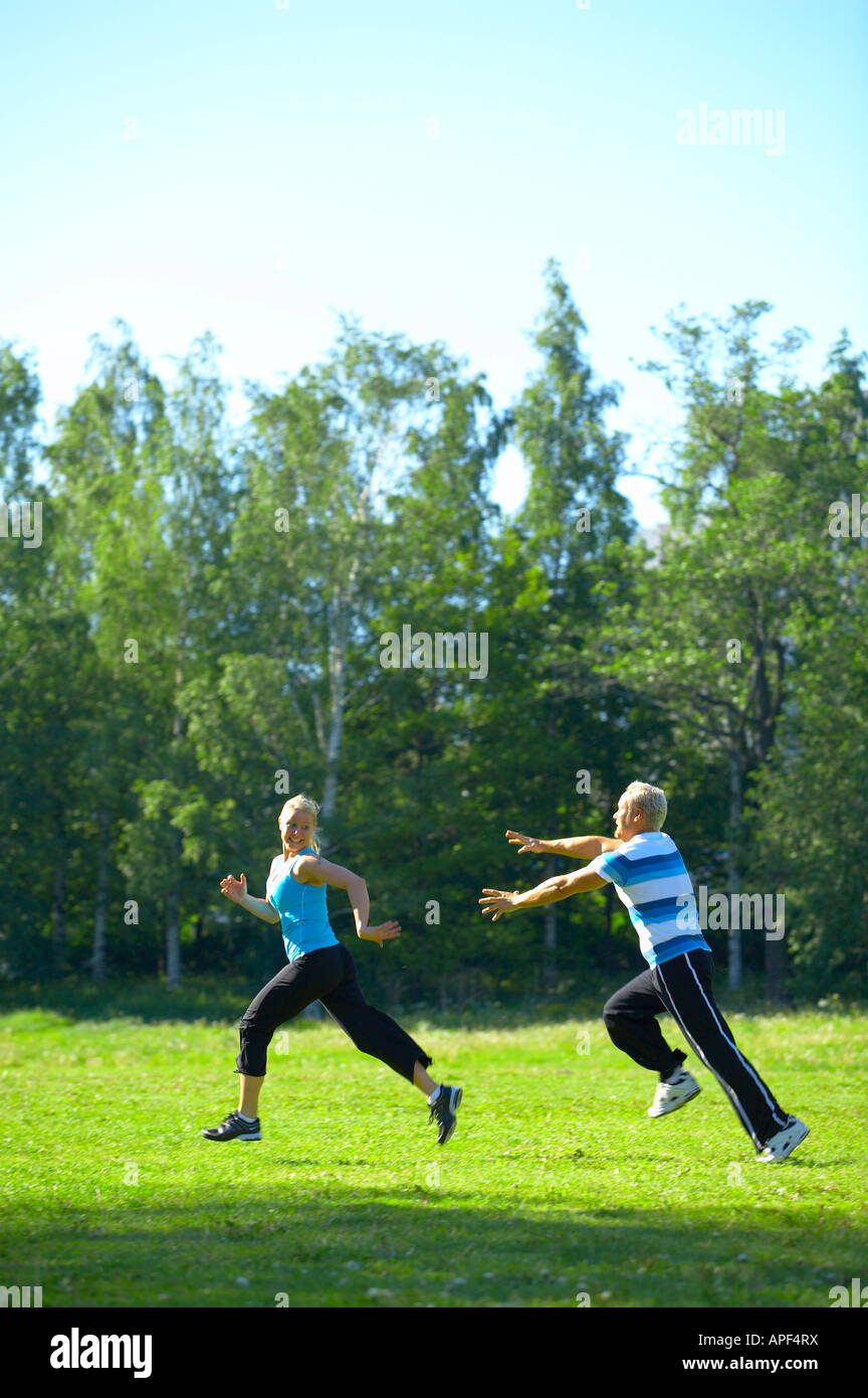 woman and men running Stock Photo - Alamy