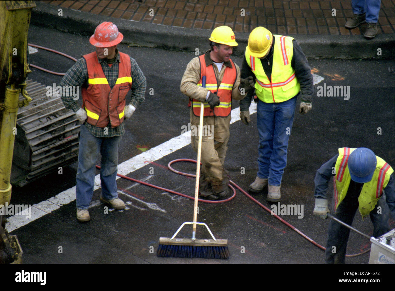 workmen on street repair Stock Photo - Alamy