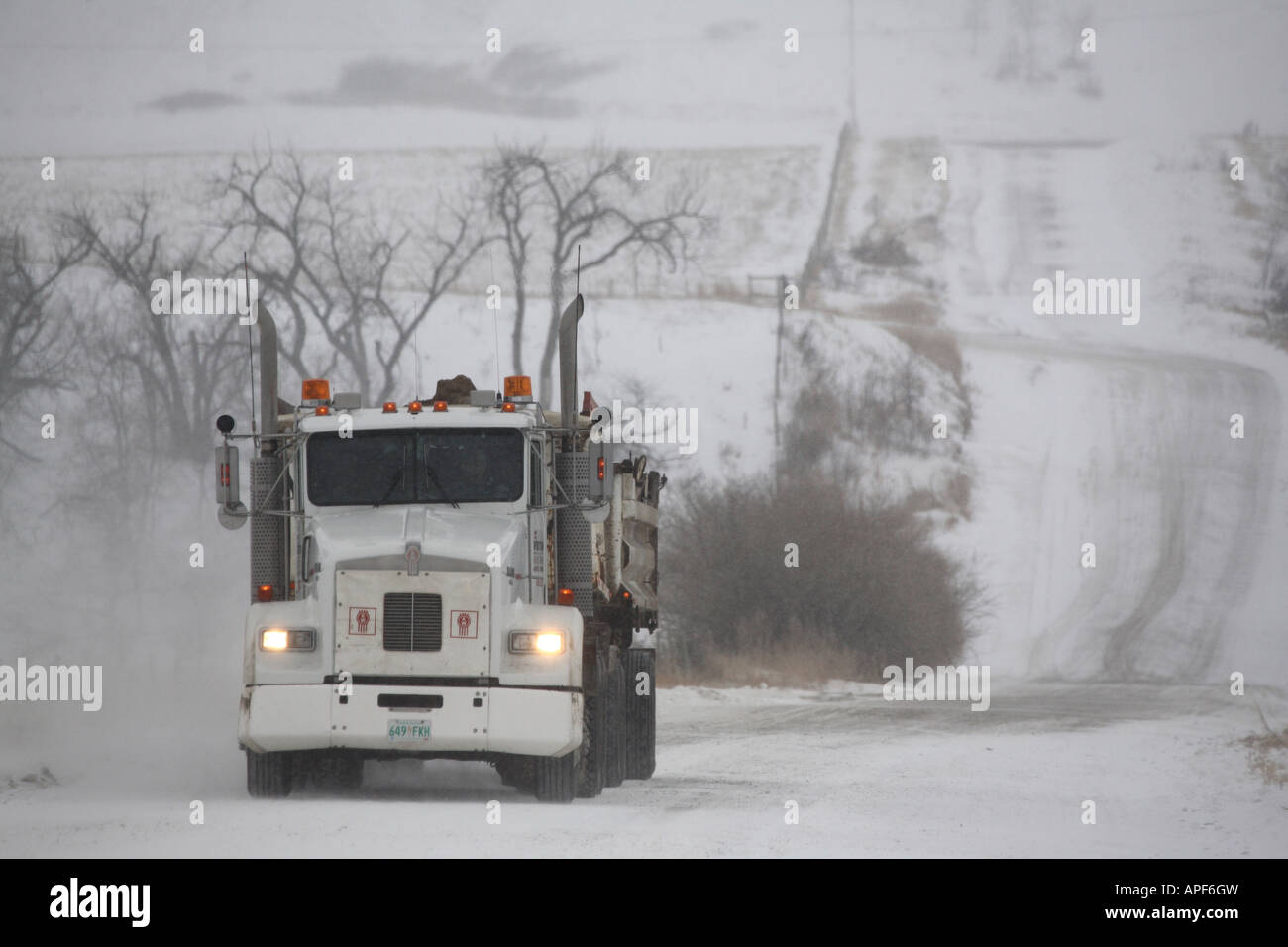 Gravel truck climbing slope Stock Photo - Alamy