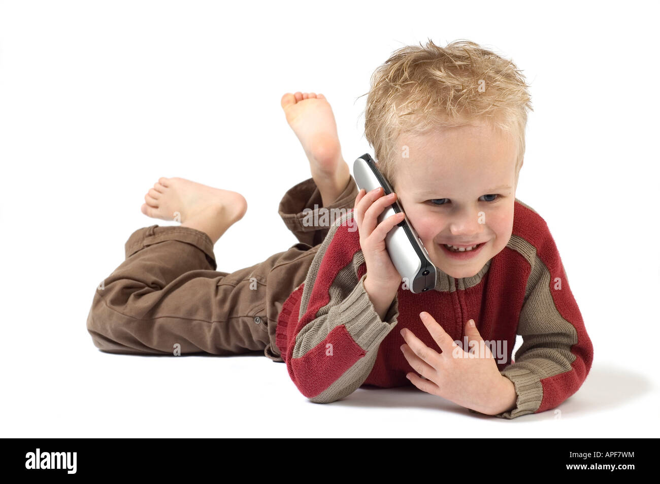Little boy on the phone calling his grandpa Isolated on white Stock ...