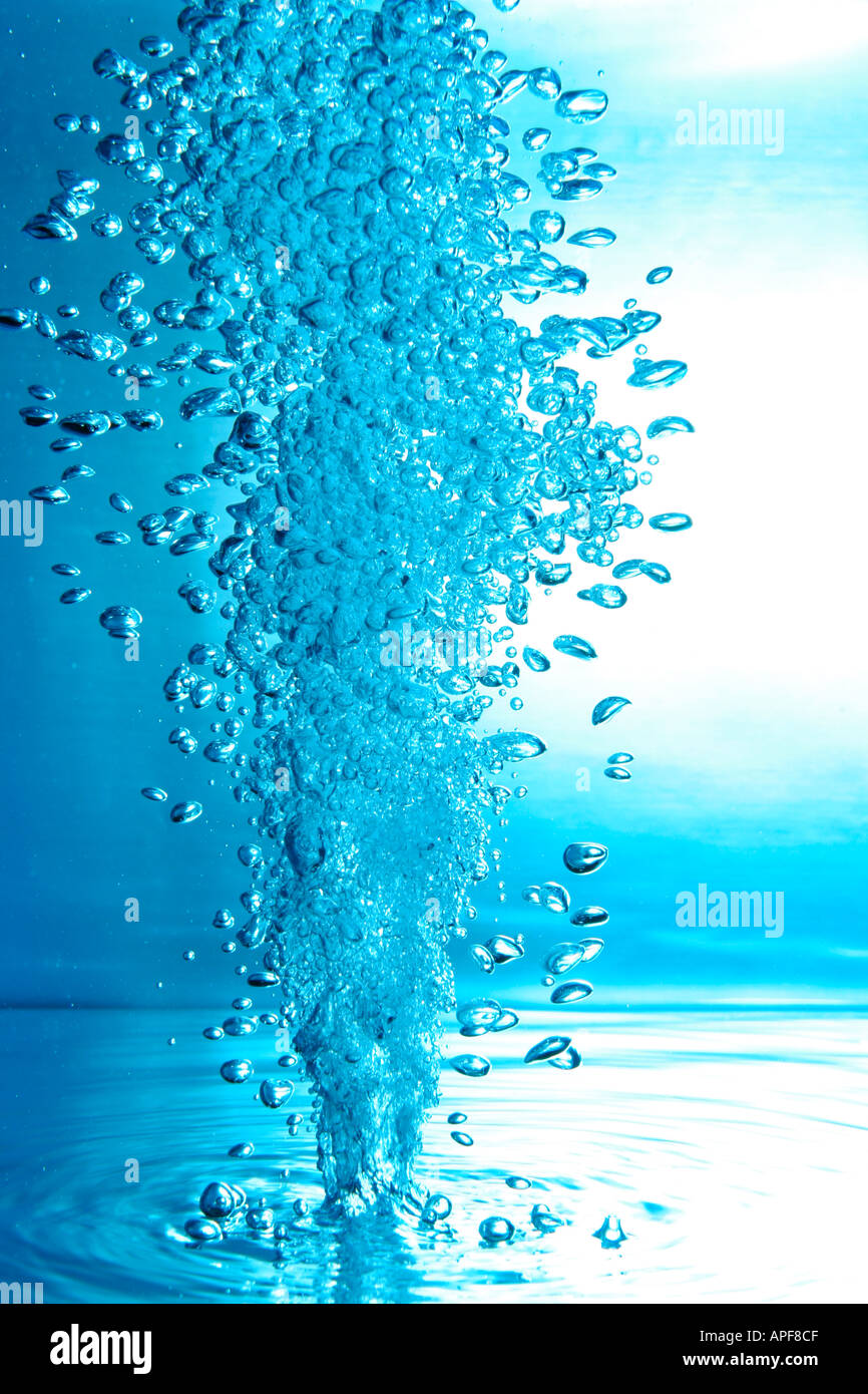 air bubbles water jet gets through water surface picture is turned by ...