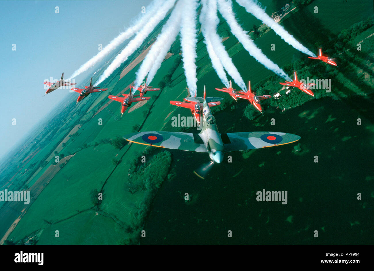 Red Arrows aerobatic team with spitfire Stock Photo - Alamy