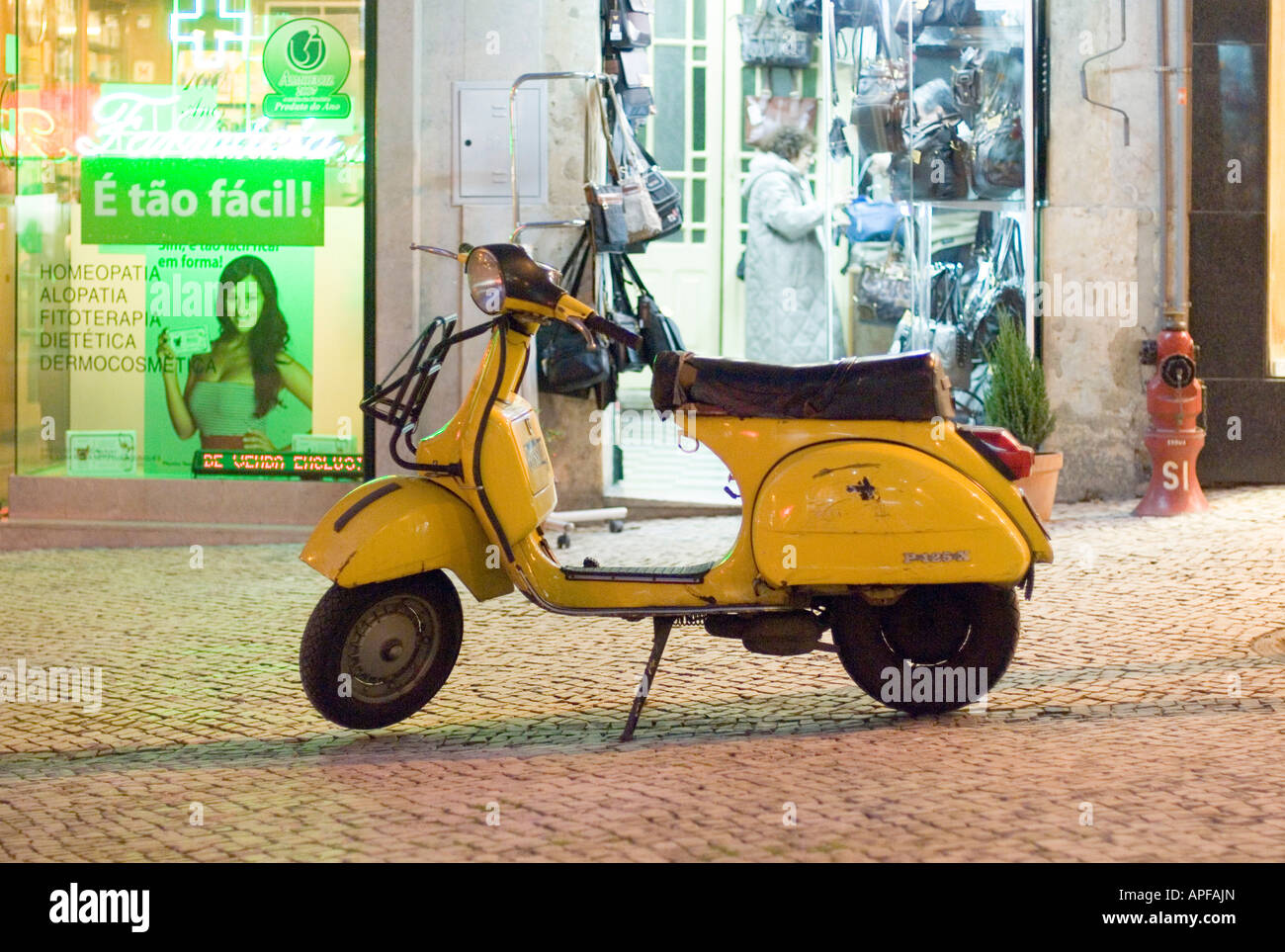 A yellow vespa in Lisbon Portugal Stock Photo - Alamy