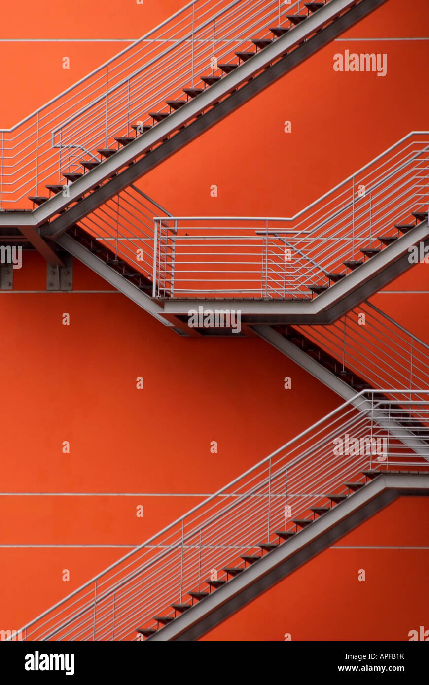 Fire exit on an orange building Stock Photo - Alamy