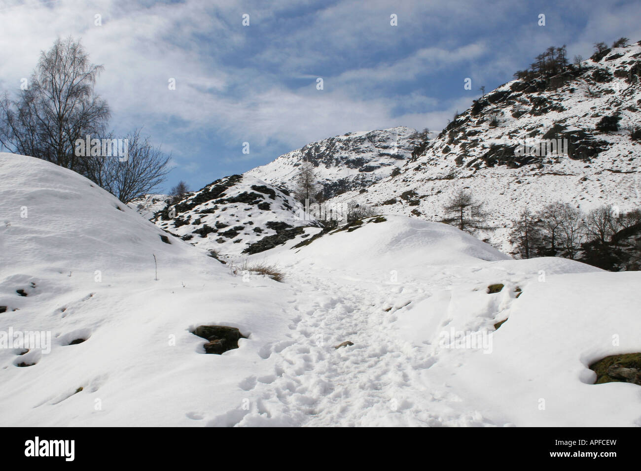 The approach to Wetherlam covered in snow on a pleasant winters day ...