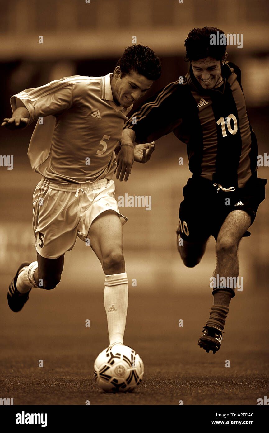 Professional football chasing ball hi-res stock photography and images ...