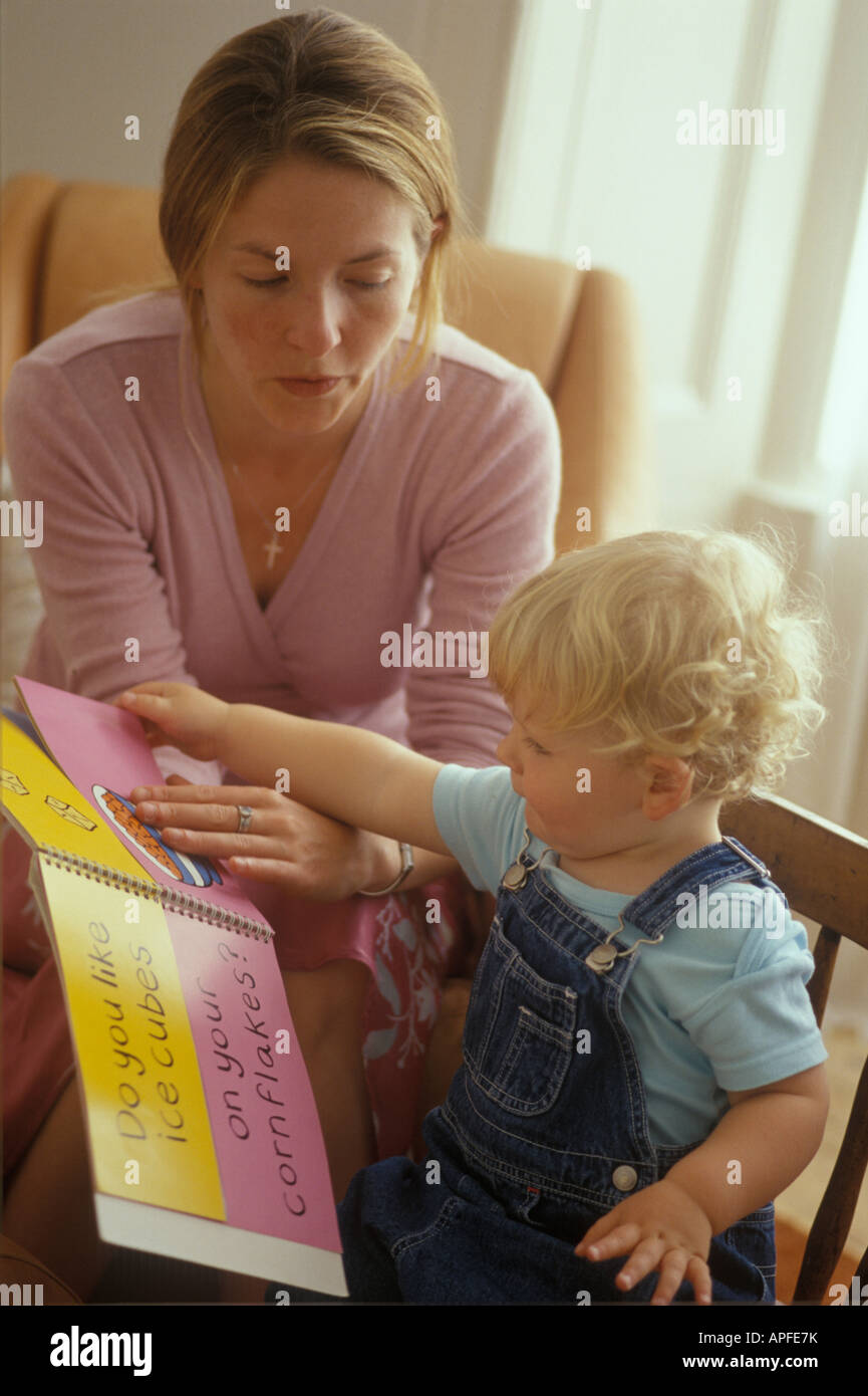 mother and toddler reading a book together Stock Photo - Alamy