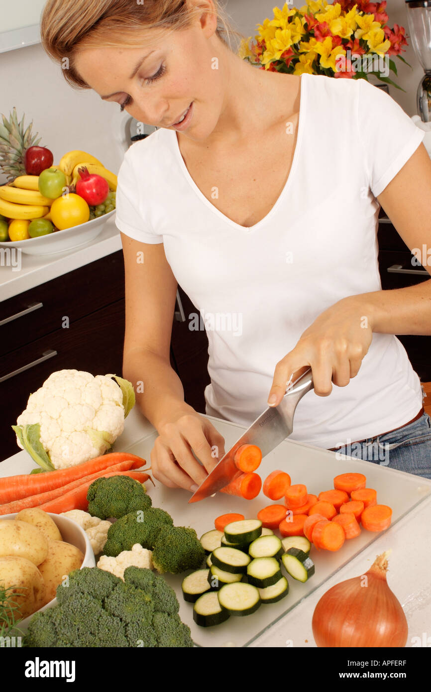 Woman peeling fresh zucchini hi-res stock photography and images - Alamy