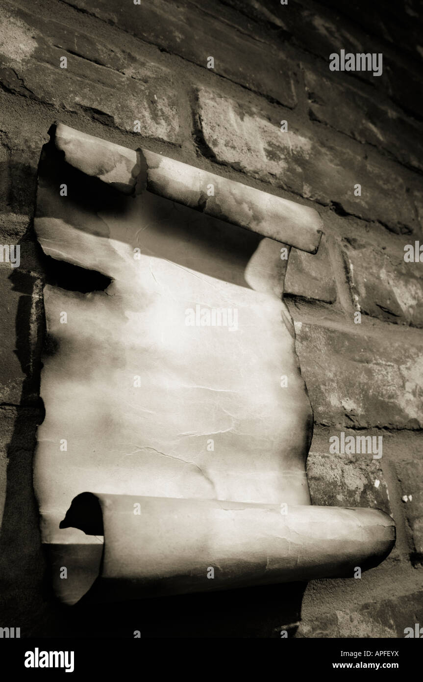 Old parchment on a brick wall Stock Photo - Alamy