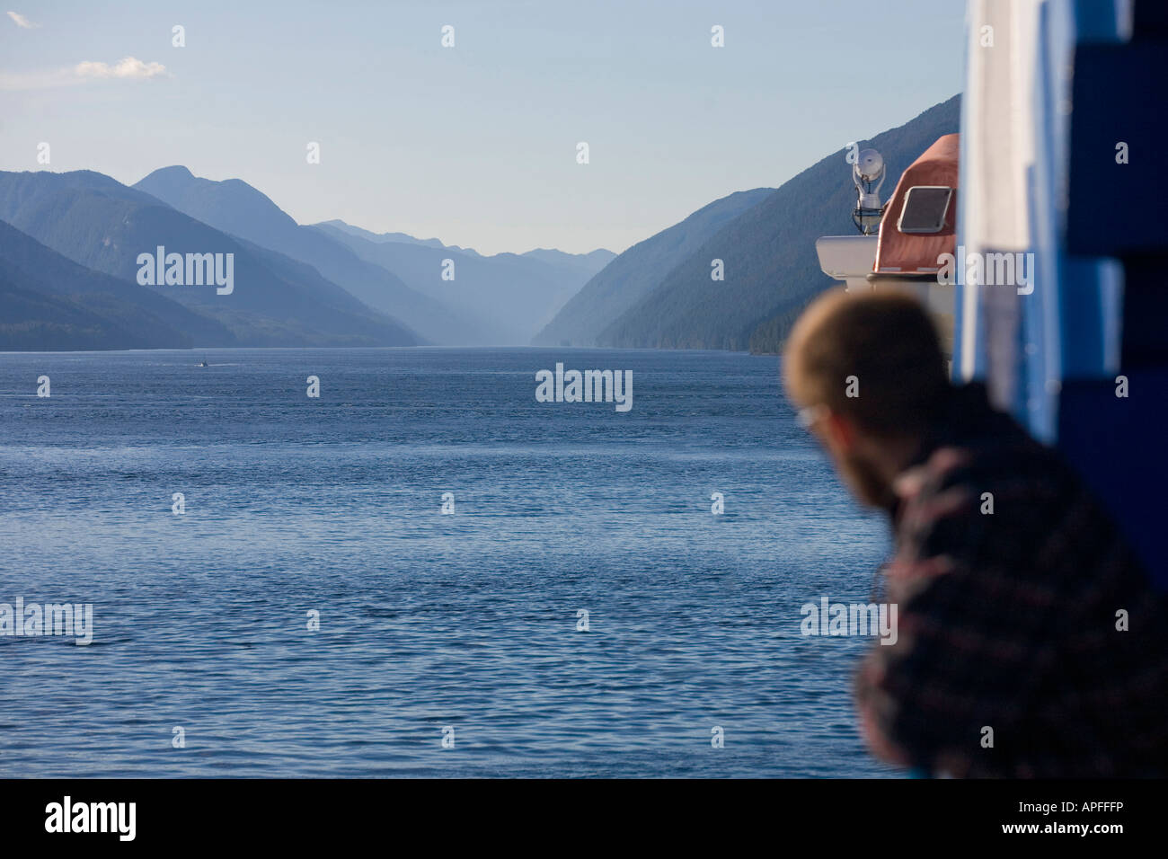 A young man watches the scenery glide past Stock Photo - Alamy