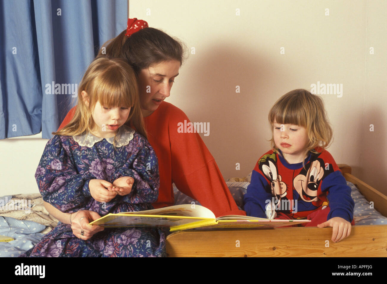 Woman reading bedtime story children hi-res stock photography and ...