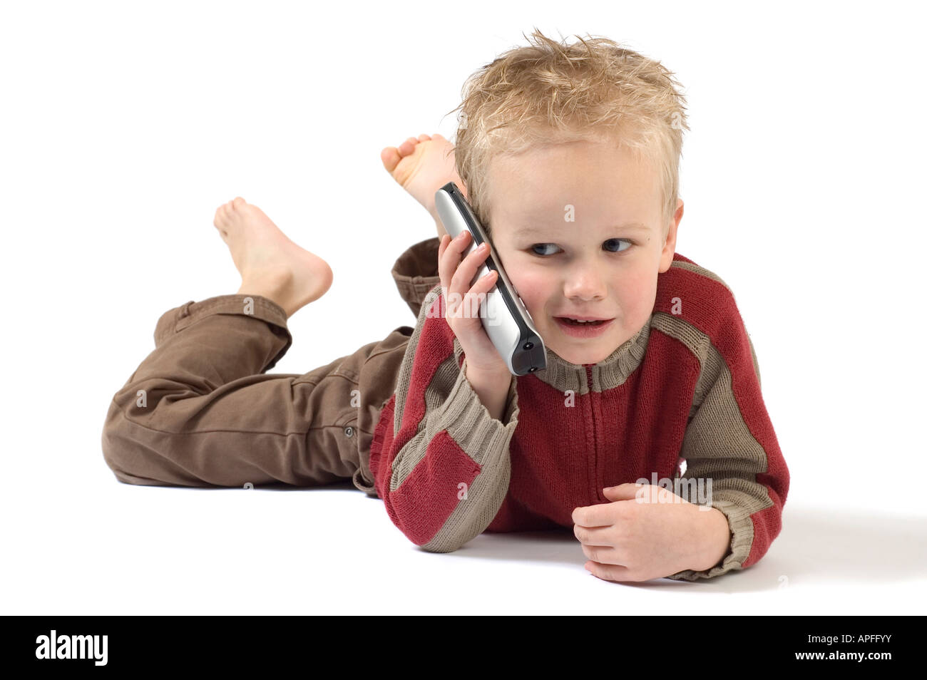 Little boy on the phone calling his grandpa Isolated on white Stock ...