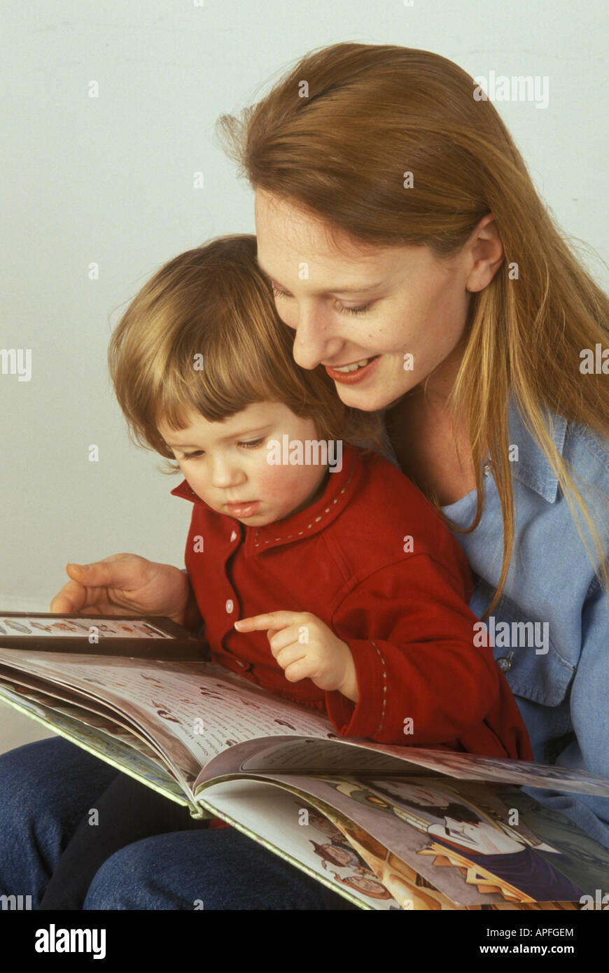 mother and child reading together Stock Photo - Alamy