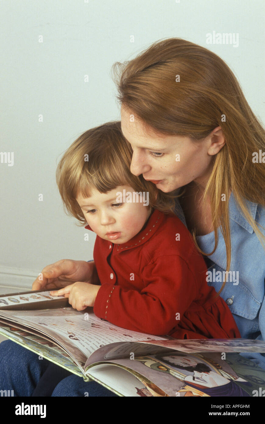 mother and child reading together Stock Photo - Alamy