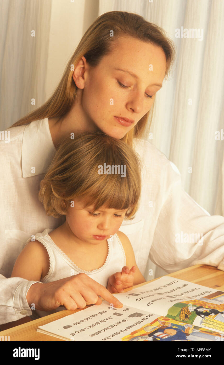 mother and child reading together Stock Photo - Alamy
