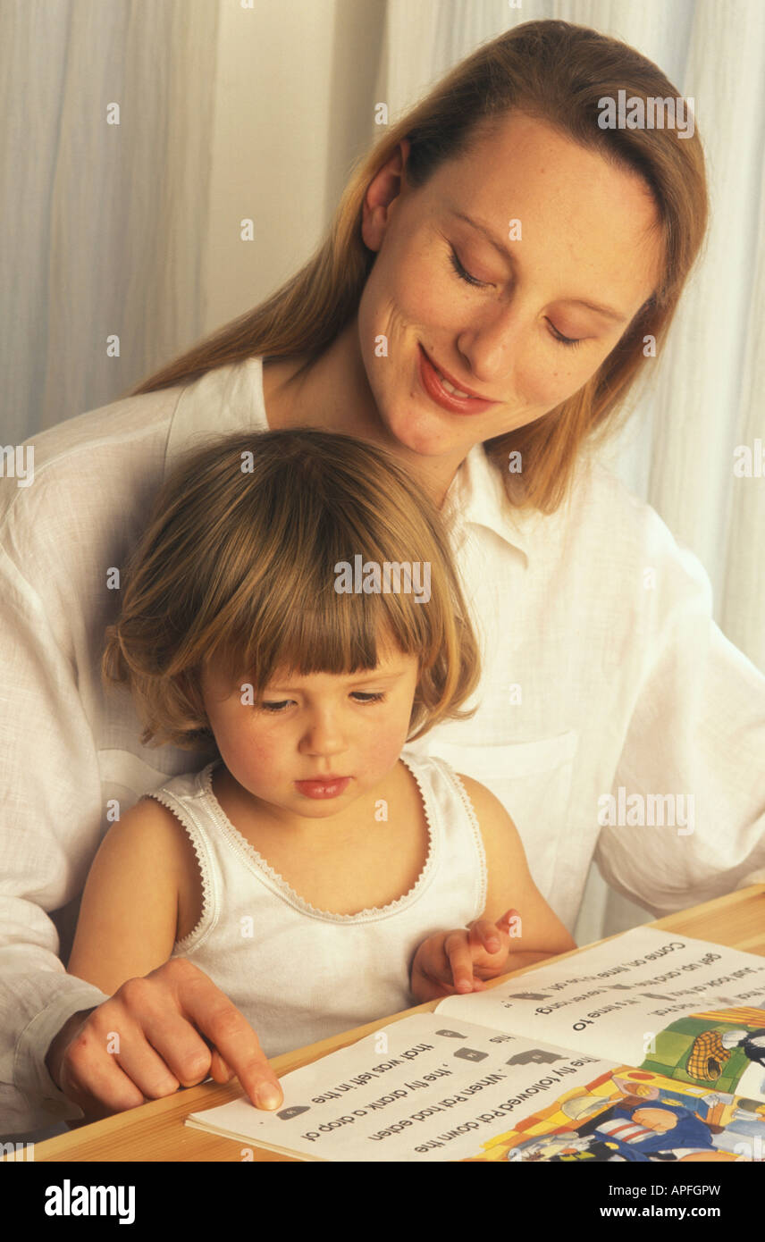 mother and child reading together Stock Photo - Alamy