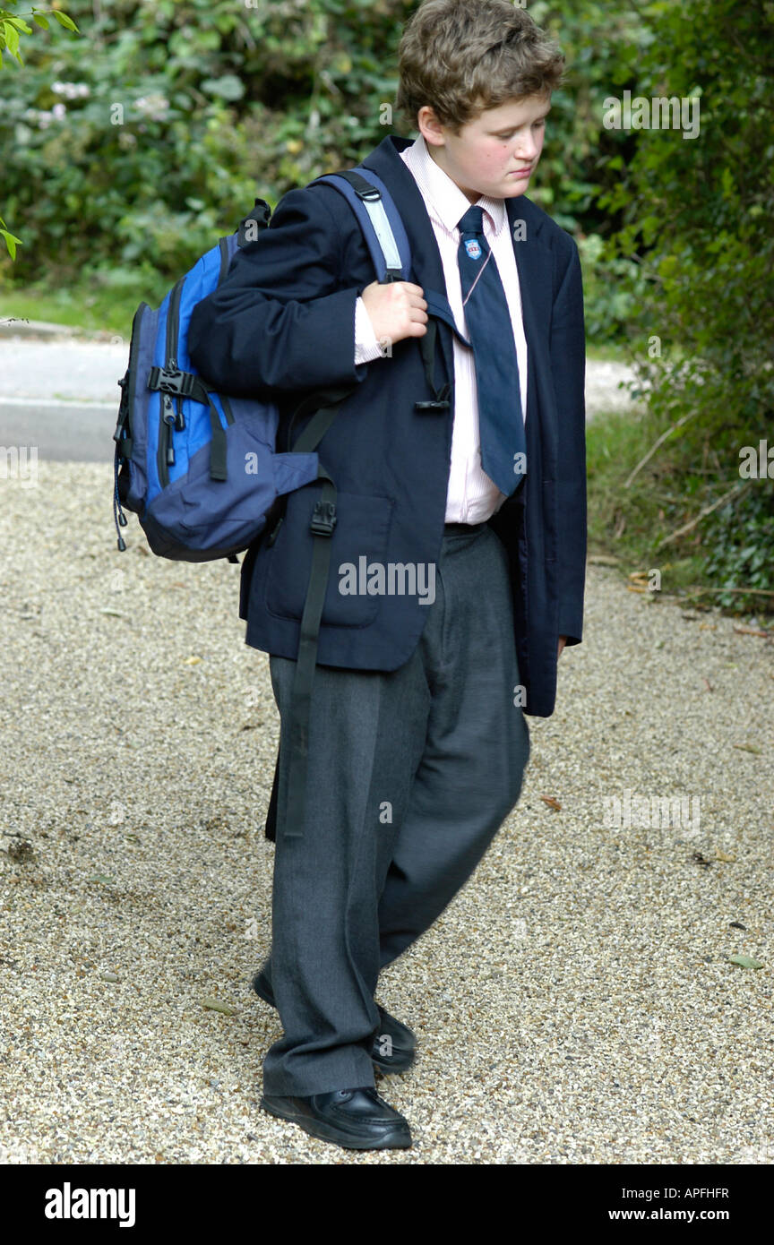 boy looking miserable going to school Stock Photo - Alamy