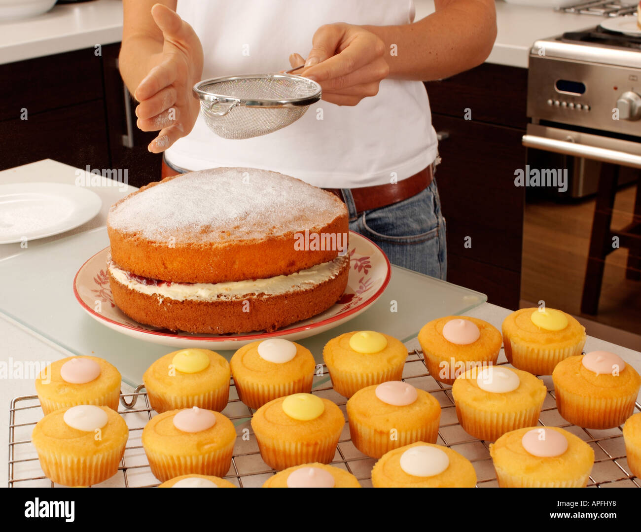 WOMAN BAKING CAKES IN KITCHEN Stock Photo - Alamy