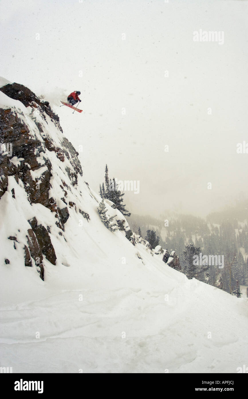 Male telemark skier jumping off a cliff at Alta Ski Area in Utah Stock ...