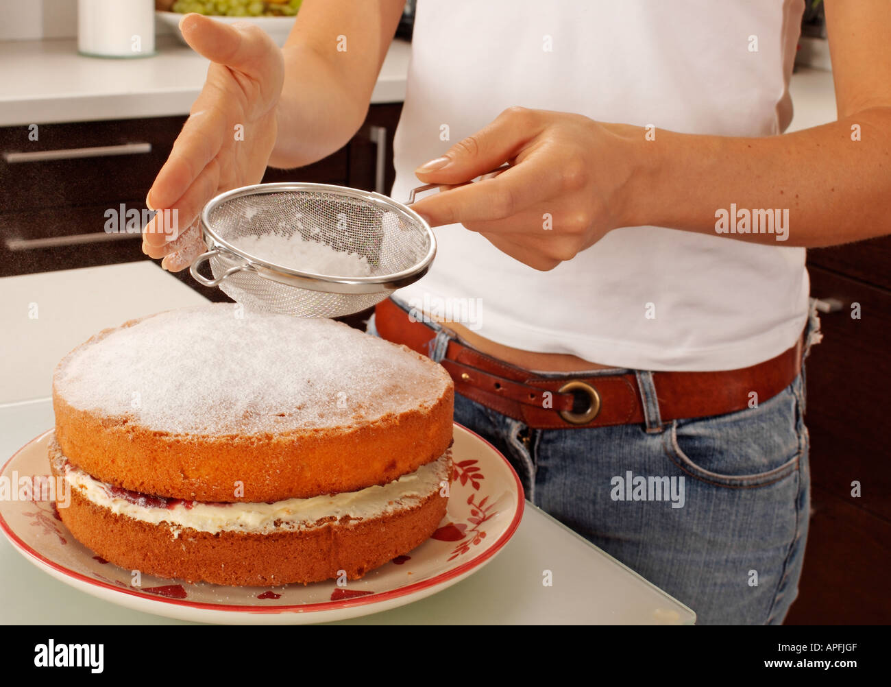 Woman dusting hands hi-res stock photography and images - Alamy