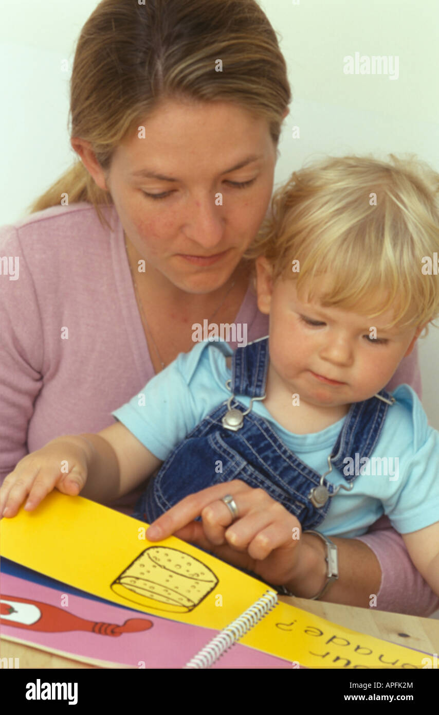 mother and toddler reading a book together Stock Photo - Alamy