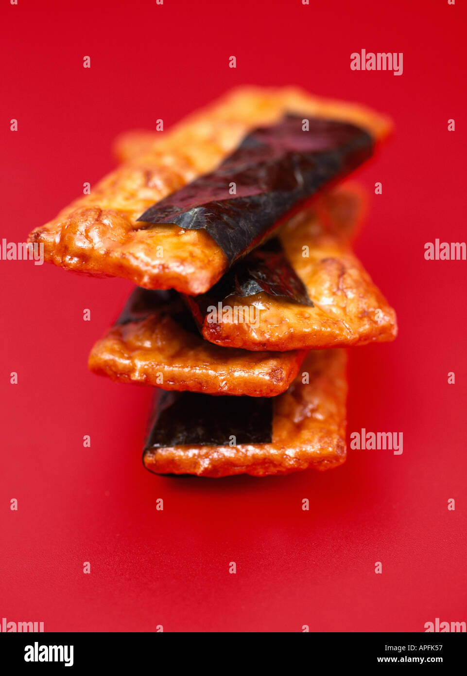 Stack of four japanese crackers on bright red background Stock Photo ...