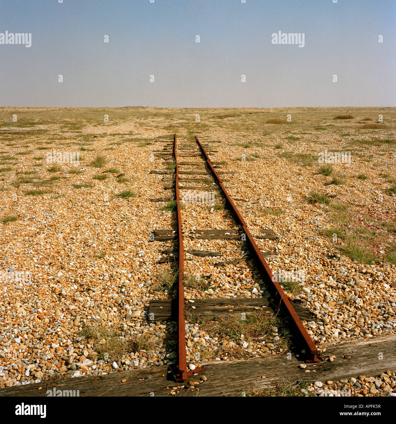 Disused and rusting narrow gauge railway track on Dungeness beach Kent ...