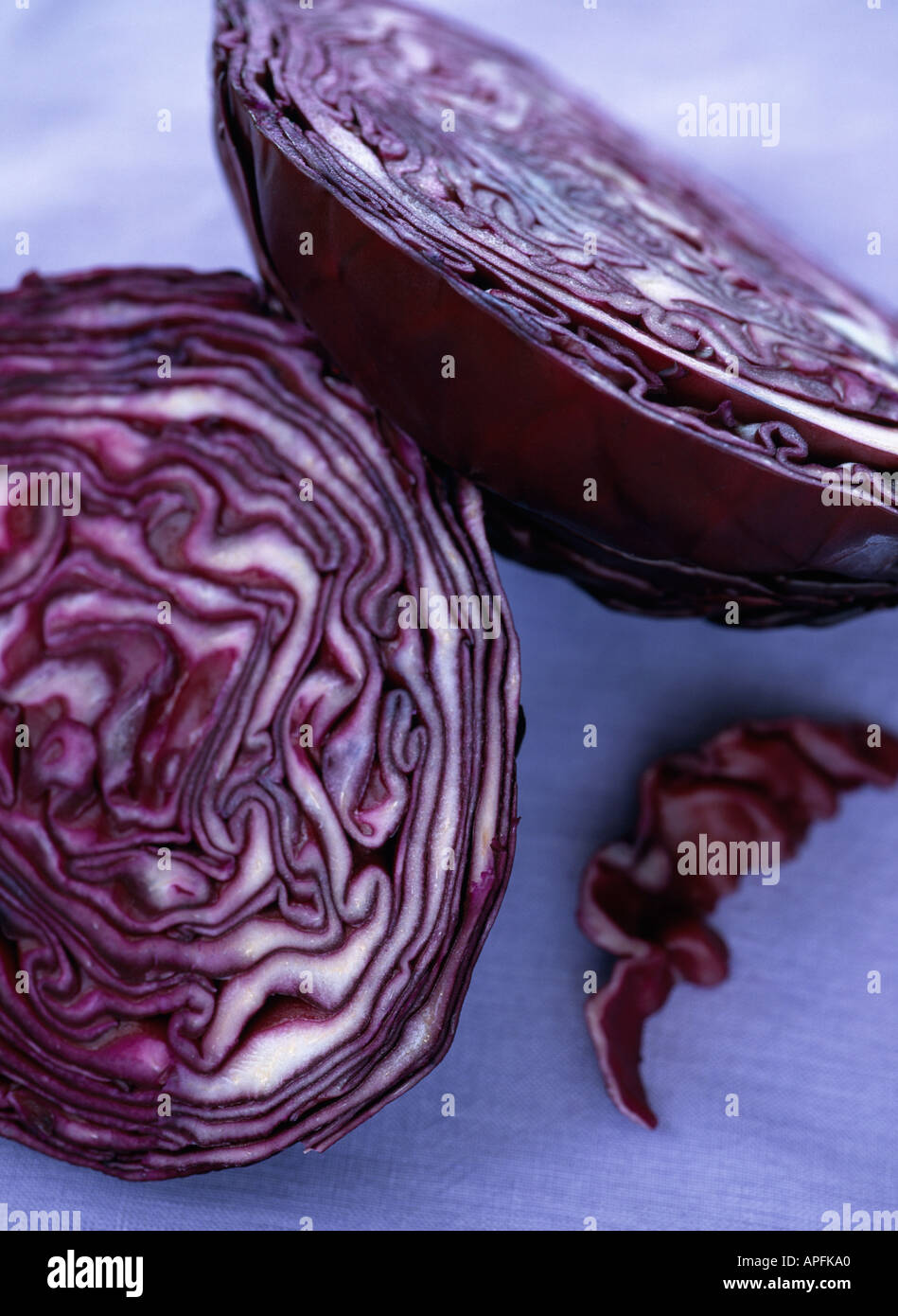Red cabbage cut in half on pale linen background Stock Photo - Alamy