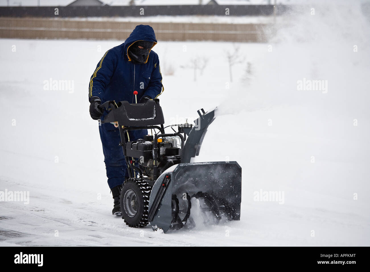 Man operating a snowblower Stock Photo - Alamy