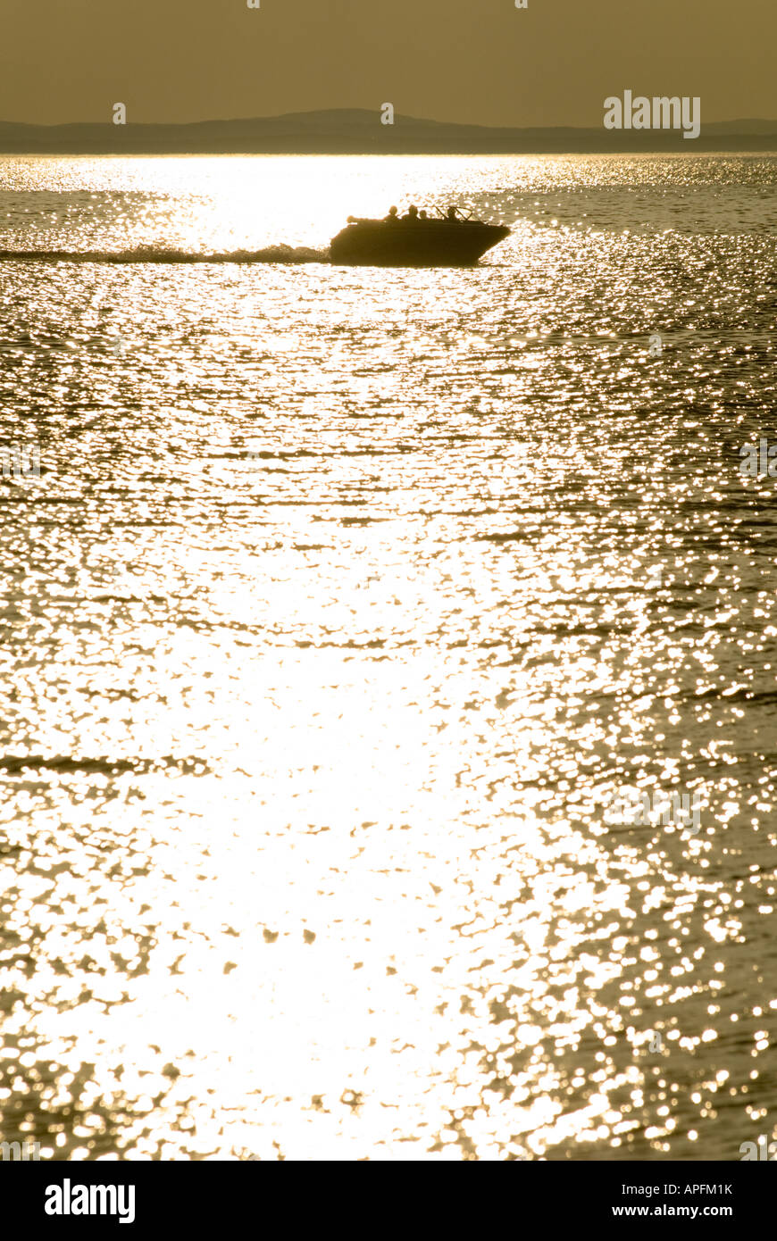 Boat at Sunset Stock Photo - Alamy