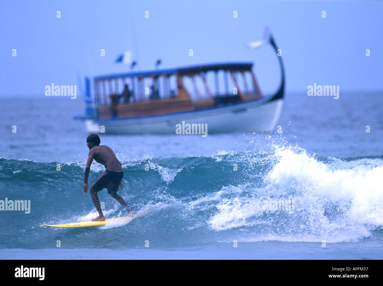 SURFING ACTION MALDIVES Stock Photo - Alamy