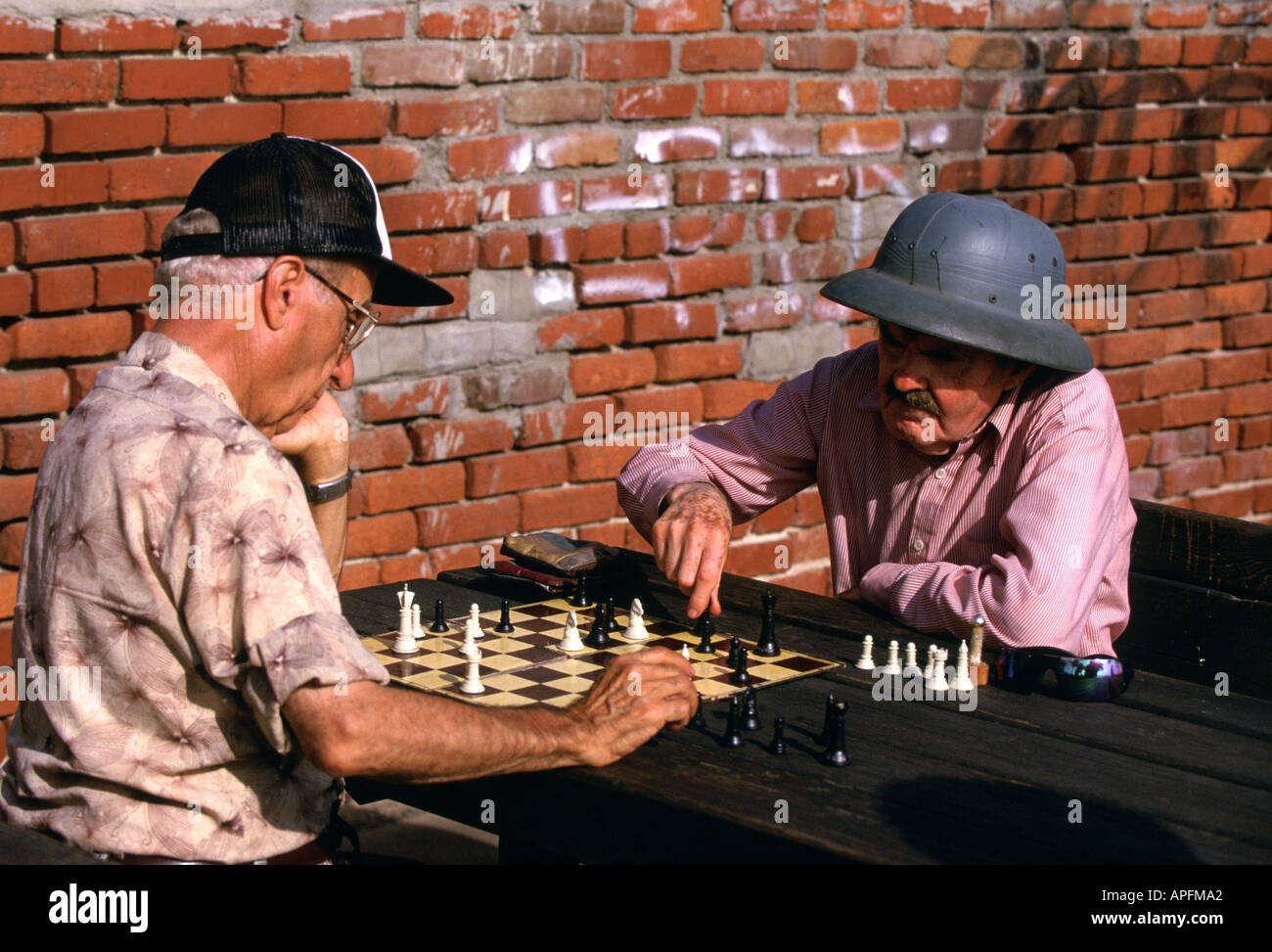 Two senior men playing chess Stock Photo - Alamy