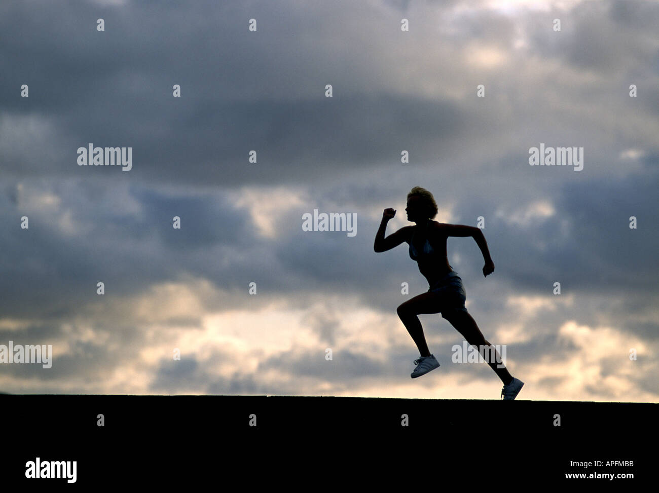 Woman silhouette running away hi-res stock photography and images - Alamy